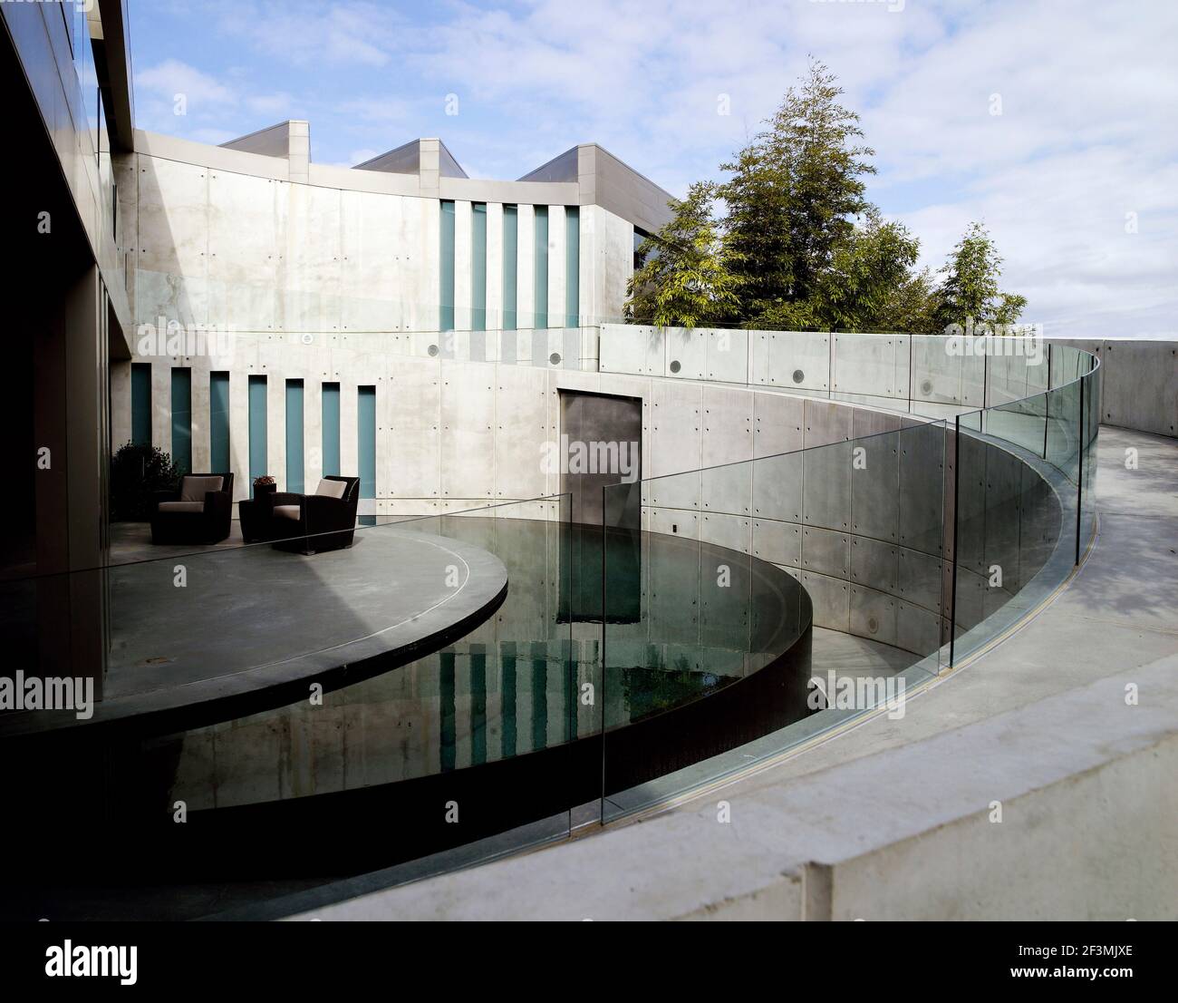 Seating on paved terrace of modern USA home Stock Photo - Alamy