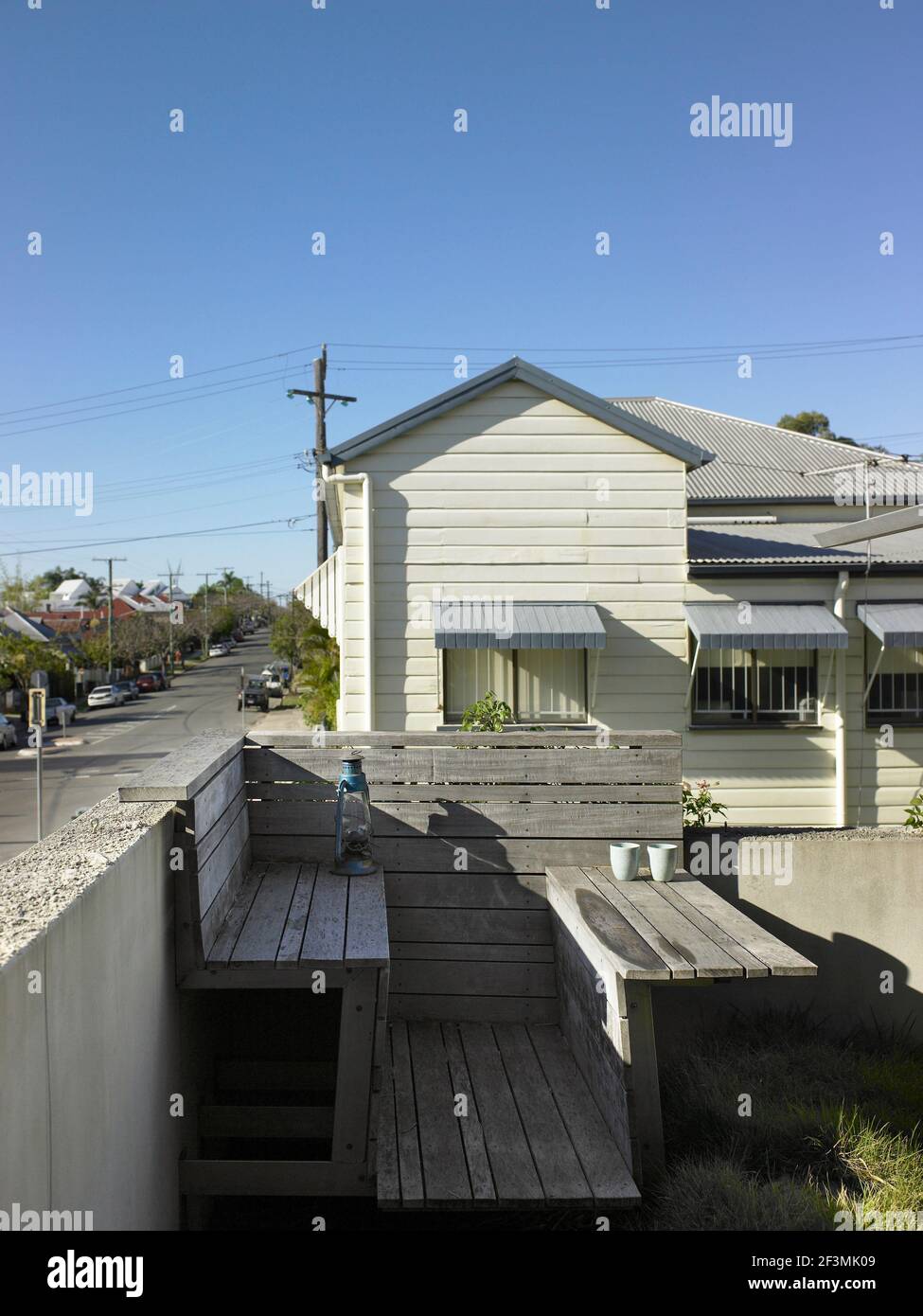 Rustic seating in garden of Australian home Stock Photo - Alamy