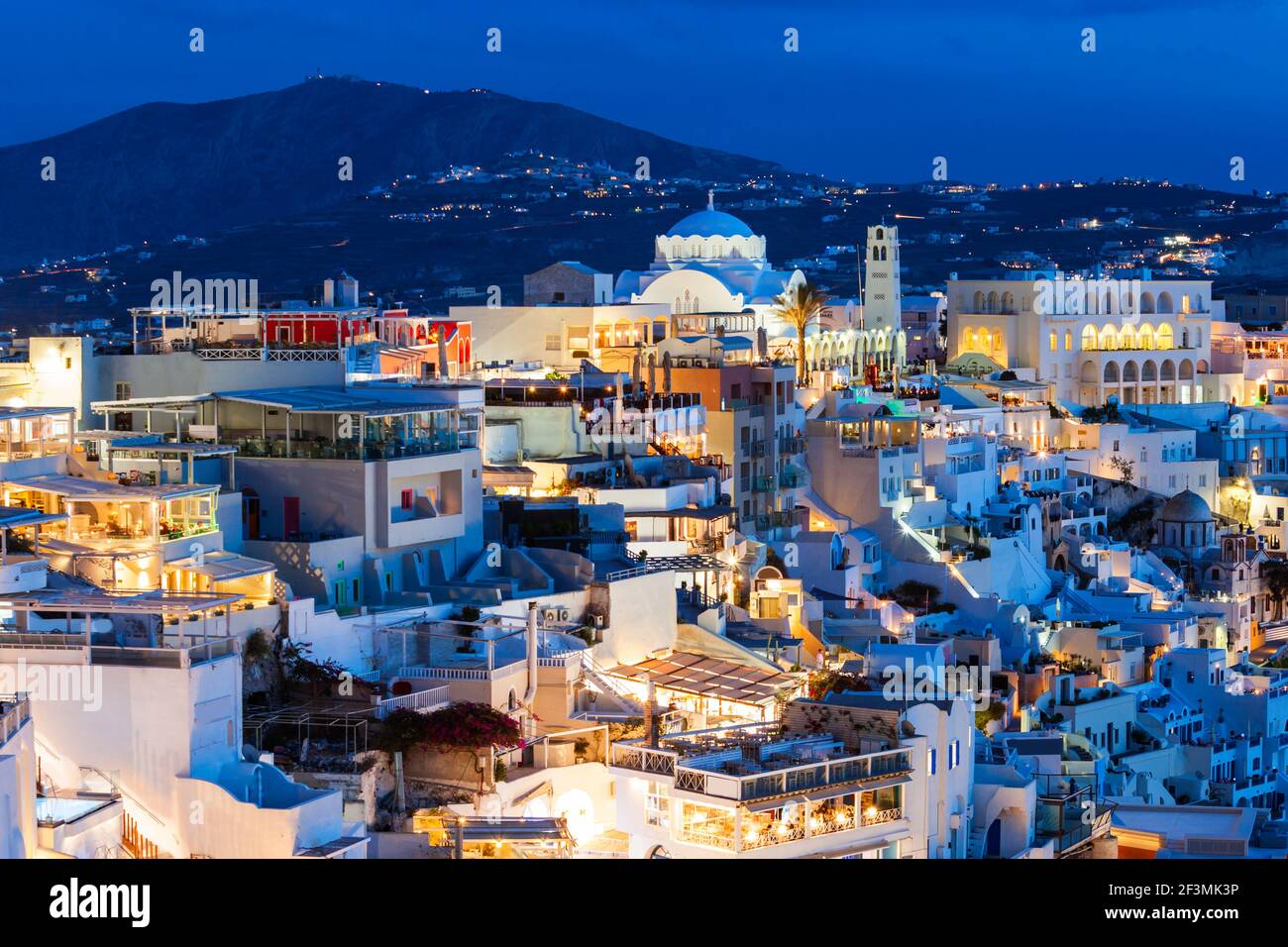 Fira town aerial panoramic view, Santorini at sunset. Fira is the ...