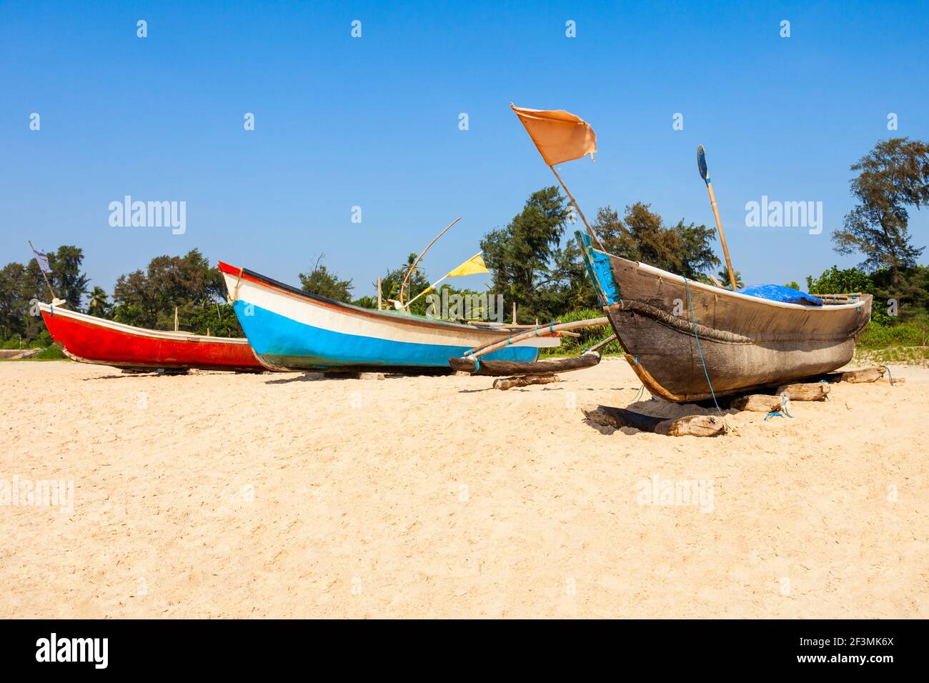 Fisherman boats on lonely goan beach in north Goa, India Stock Photo ...