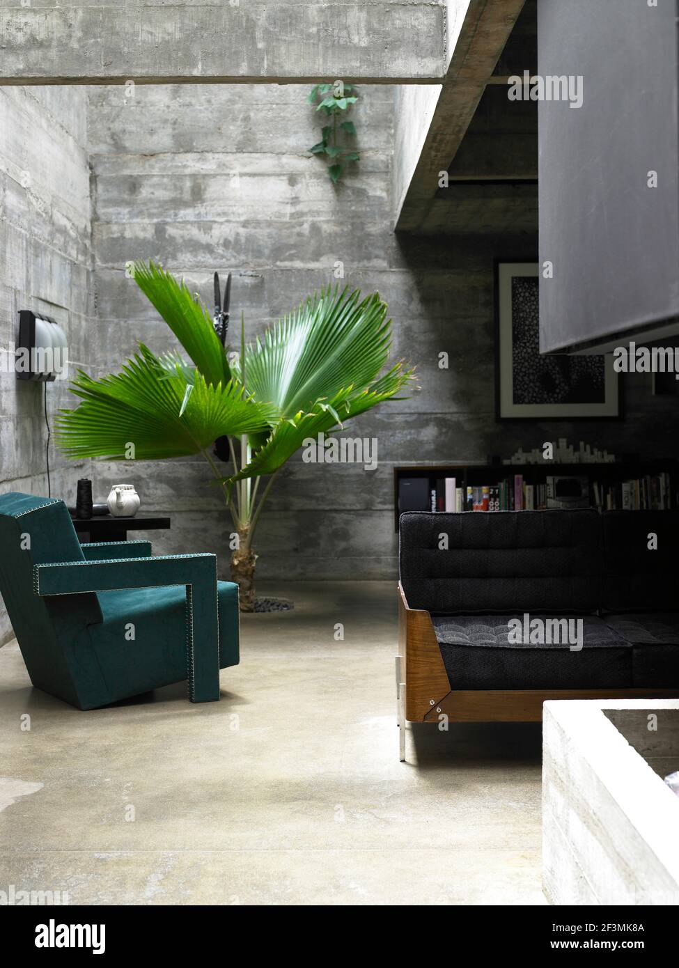 Living room with concrete walls in Brazilian home Stock Photo - Alamy