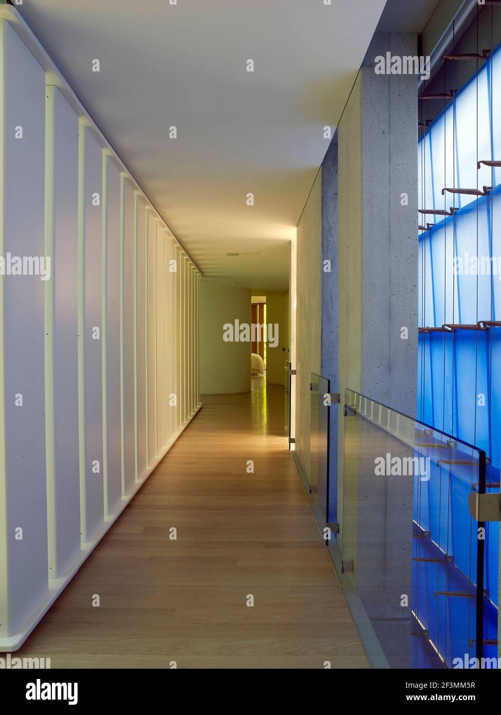 View along hallway with blue panel wall in Canadian home Stock Photo ...