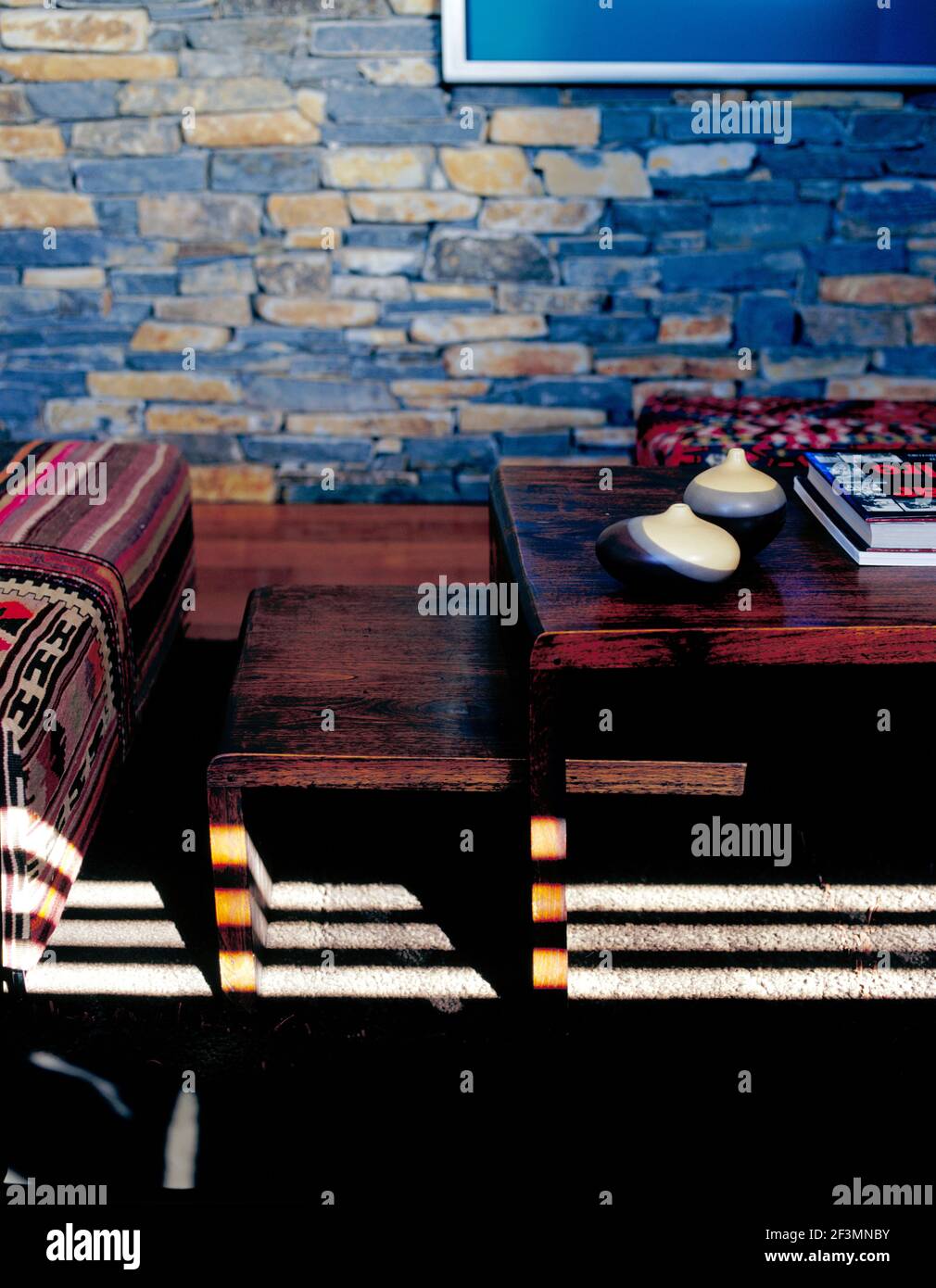 Light filters onto wooden coffee table, Bali Stock Photo - Alamy