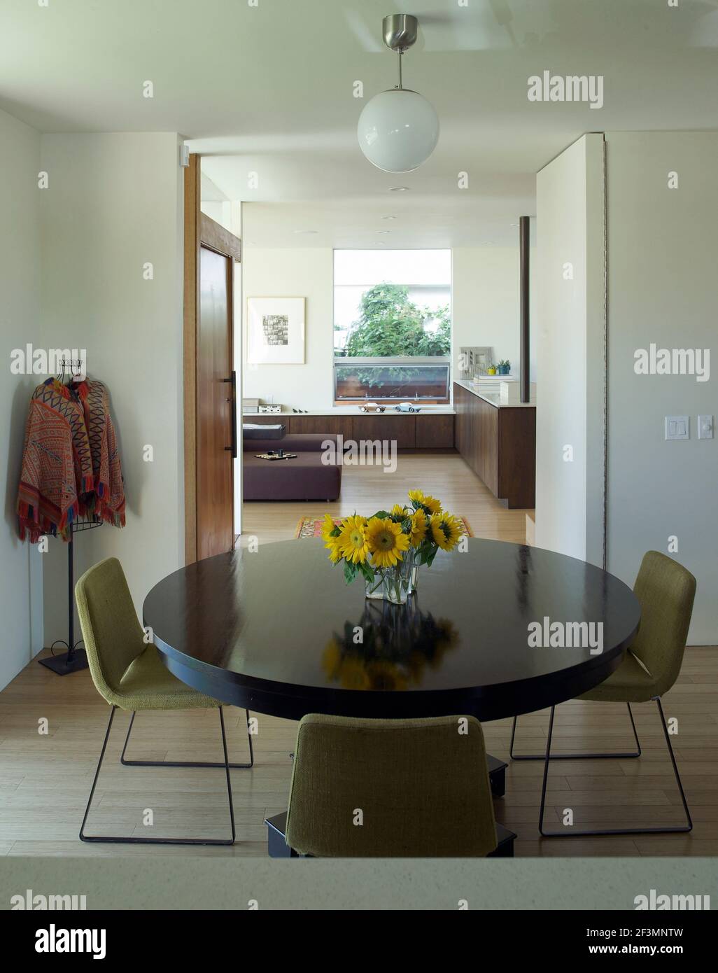 Table and chairs in dining room with view to kitchen in USA home Stock ...