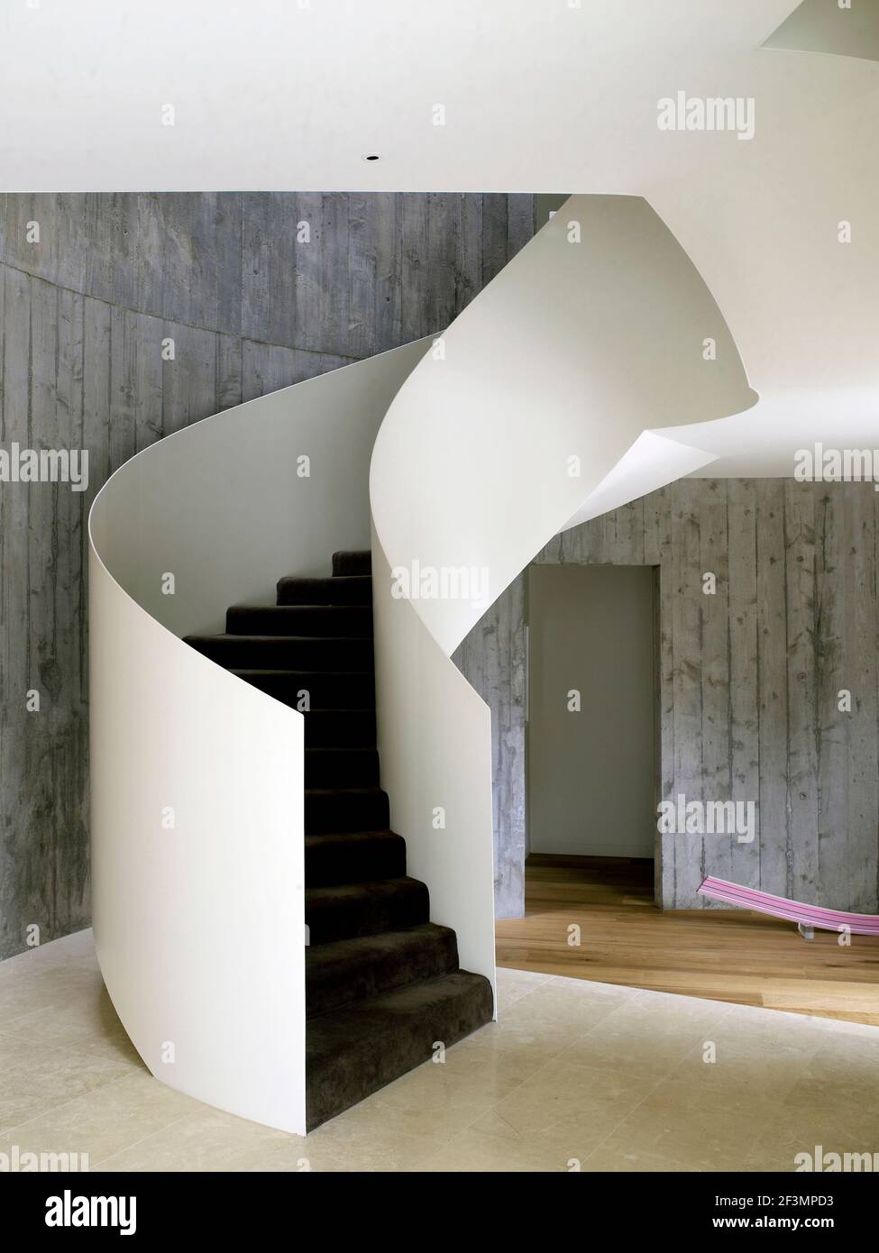 Curving staircase in hallway of Australian home Stock Photo - Alamy