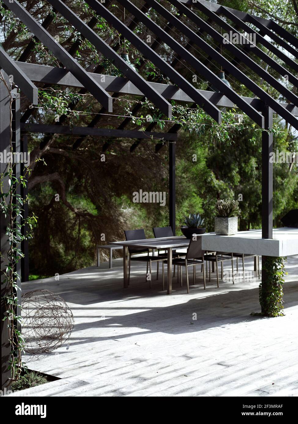 Table and chairs on shaded terrace of Australian home Stock Photo - Alamy