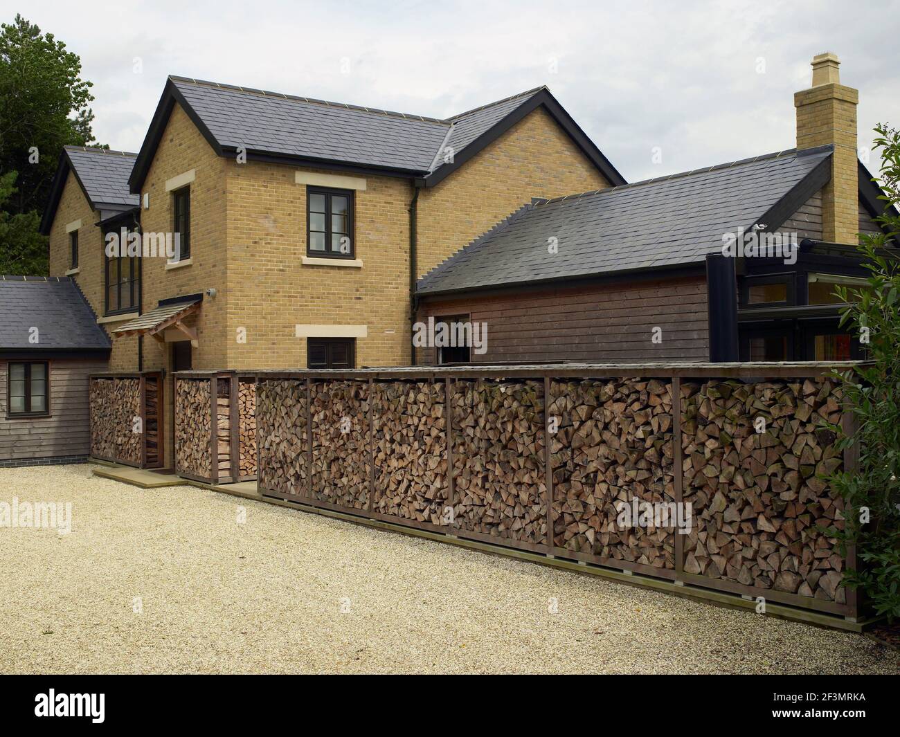 Log store outside UK home Stock Photo - Alamy