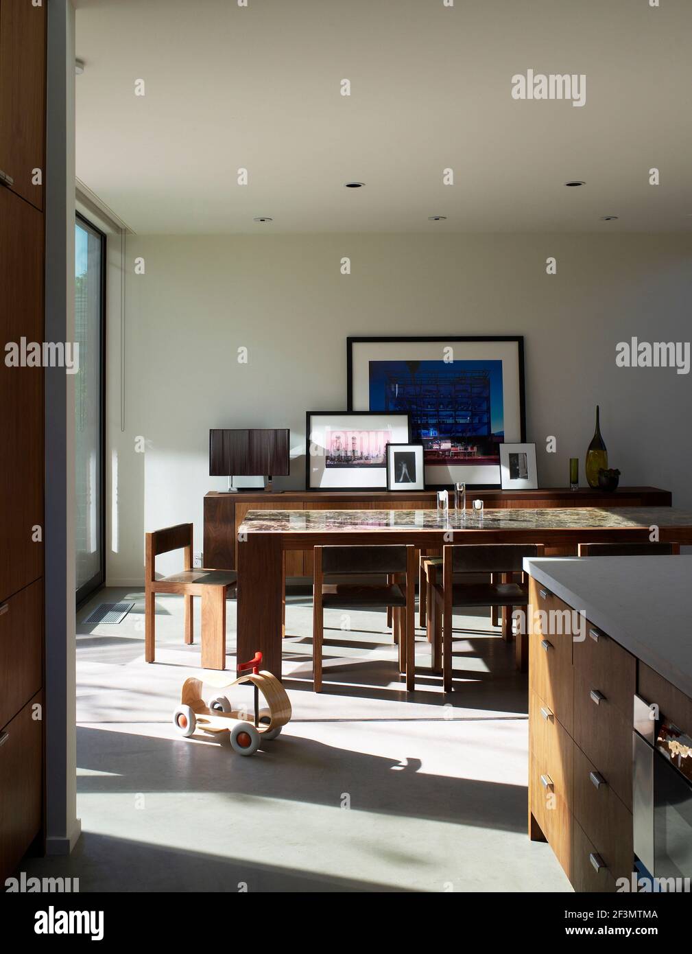 Dining table and chairs in open plan kitchen in USA home Stock Photo ...