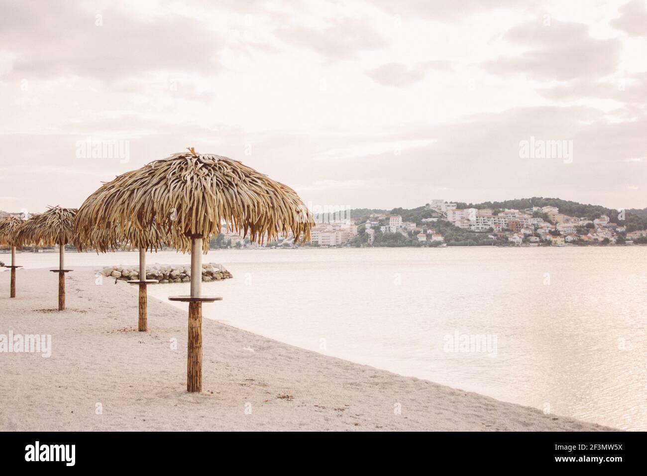 Beautiful sandy beach with parasols. Landscape view. Adriatic Sea in ...
