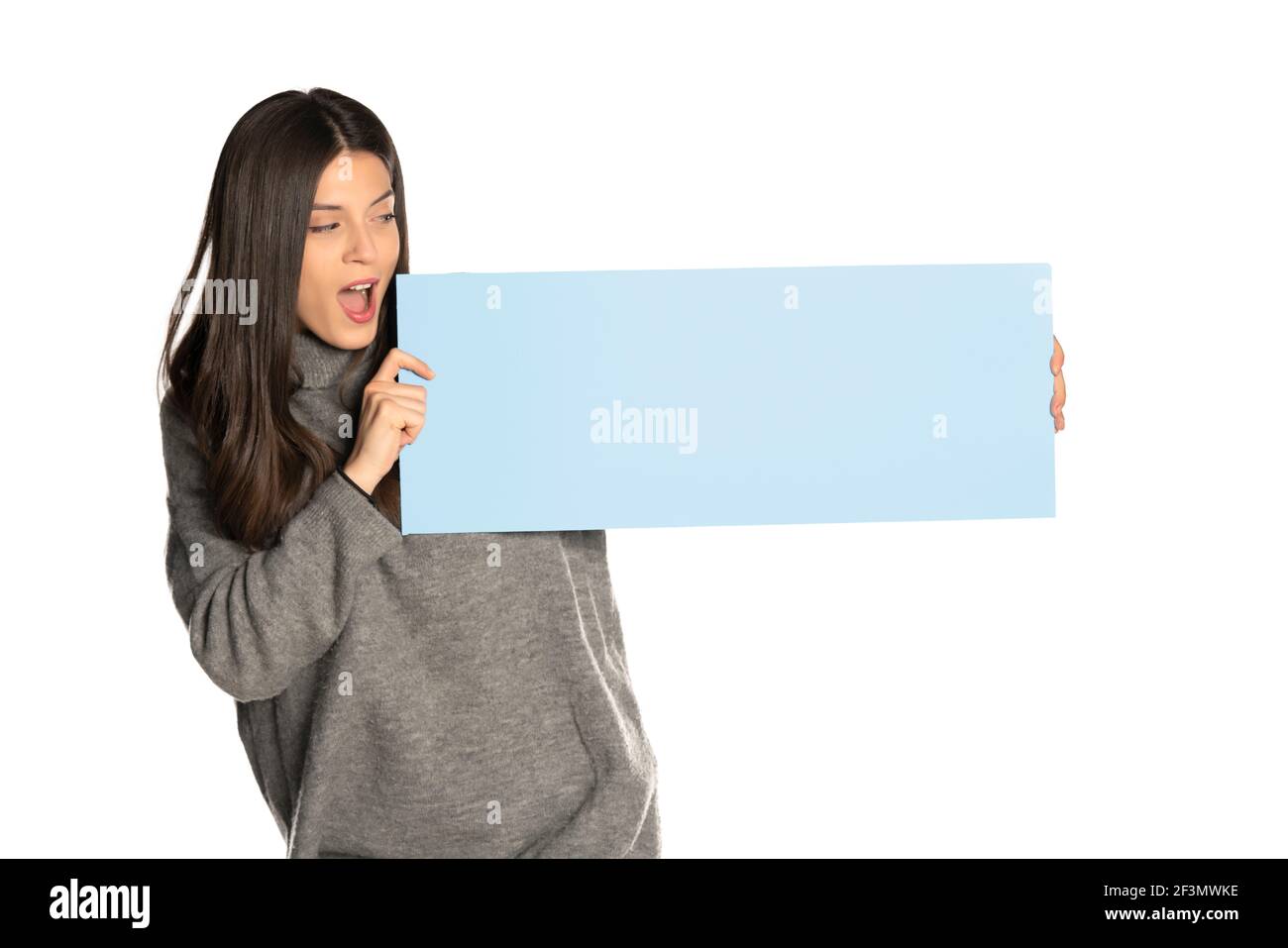 young beautiful happy woman holding a blue empty board on white ...