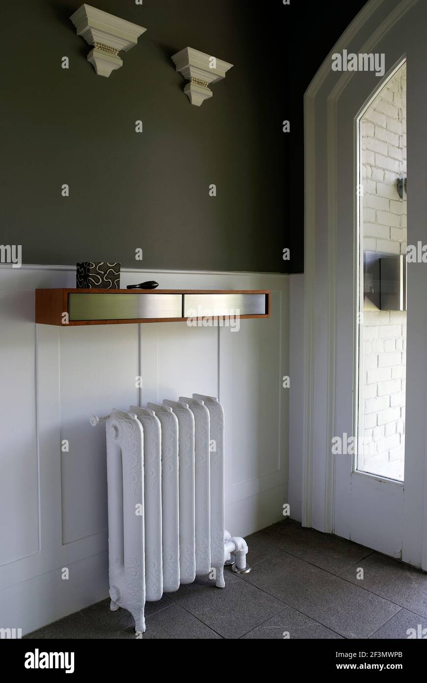 Old fashioned style radiator in hallway of Canadian home Stock Photo ...