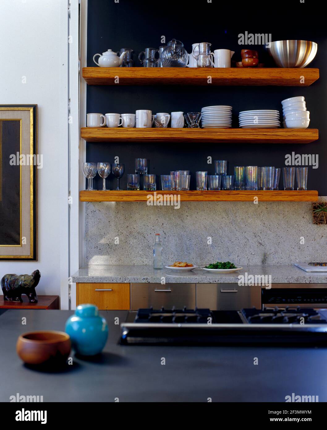 Tableware on shelving above units in kitchen, USA Stock Photo - Alamy
