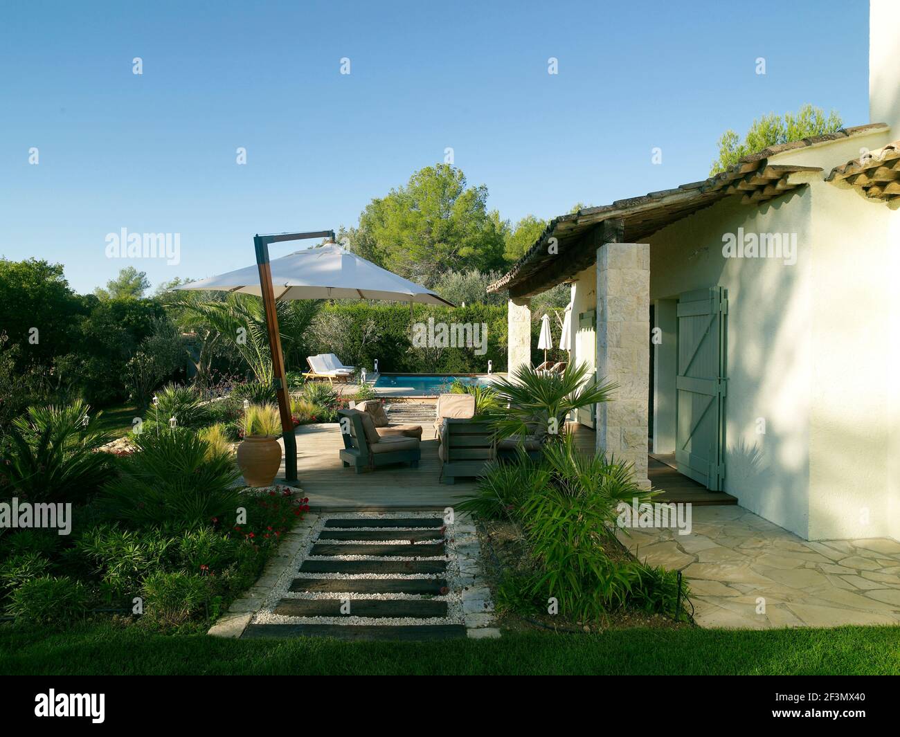 Seating on patio outside French home Stock Photo - Alamy