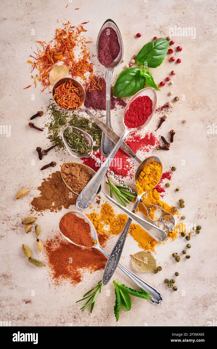 Colorful herbs and spices for cooking: turmeric, dill, paprika ...
