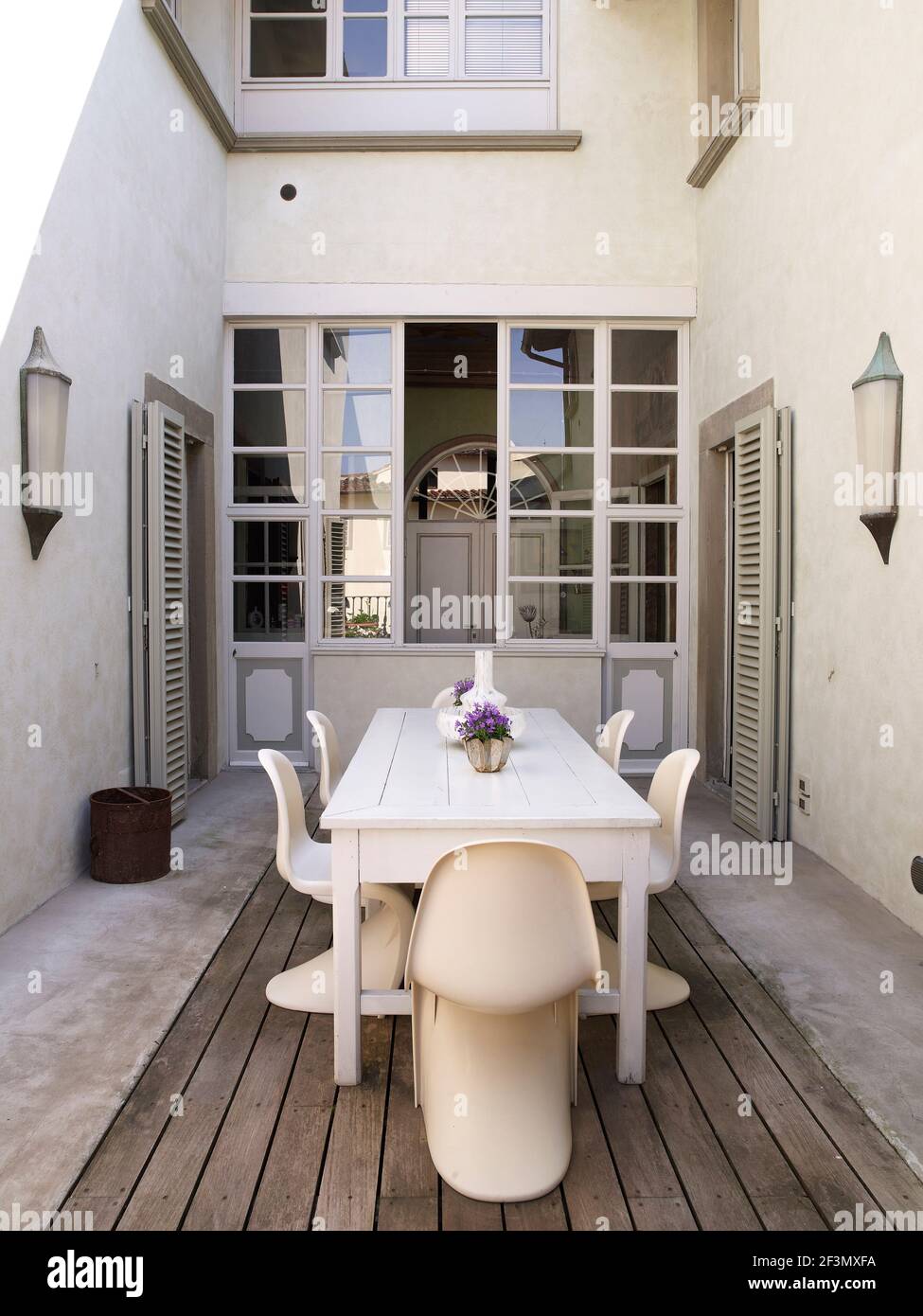 Table and chairs on terrace of Italian home Stock Photo - Alamy