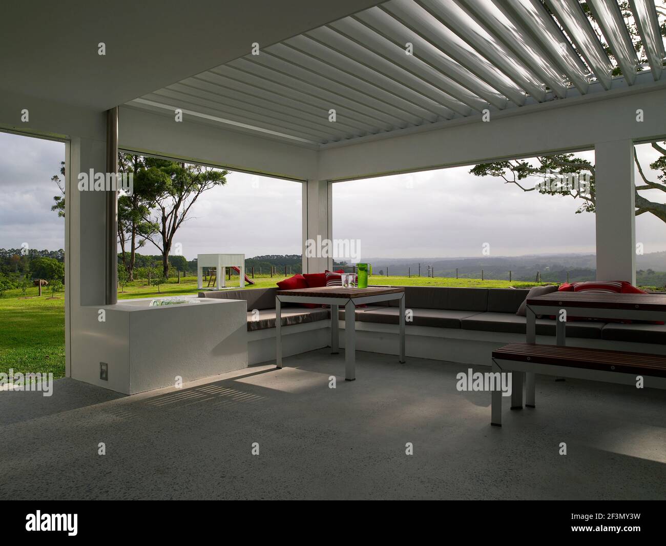 Seating on shaded terrace in Australian home Stock Photo - Alamy