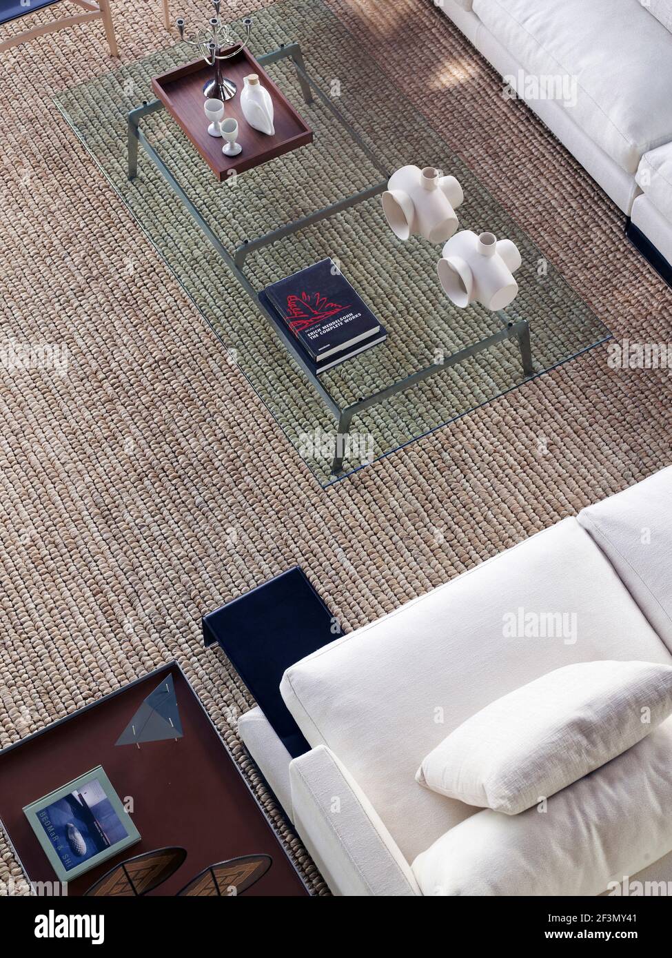 Above view of glass topped coffee table in front of sofa in living room ...