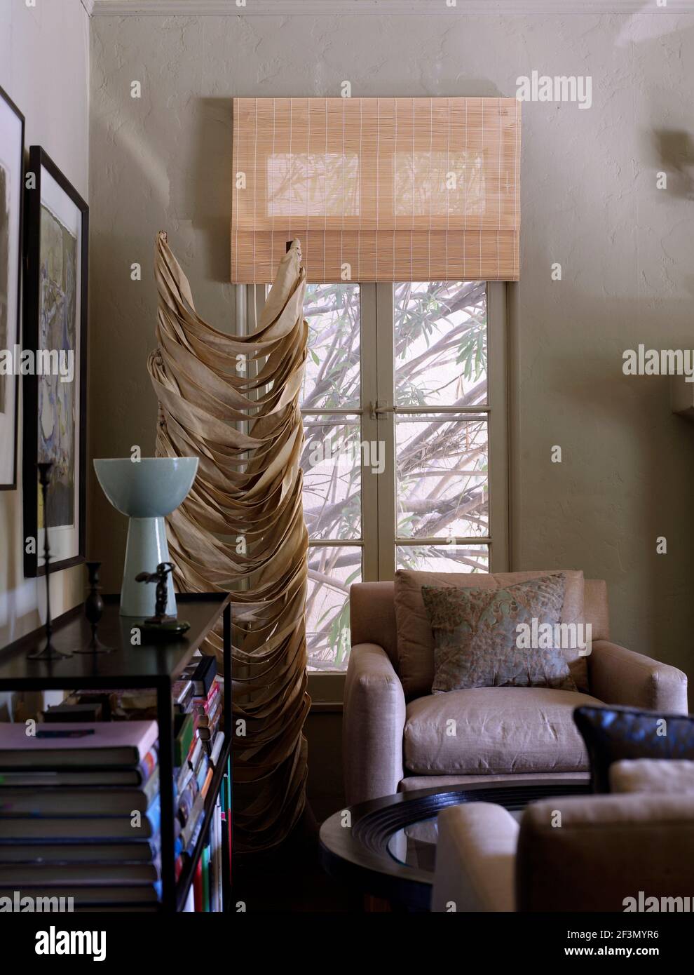 Armchair in corner of living room in USA house Stock Photo - Alamy