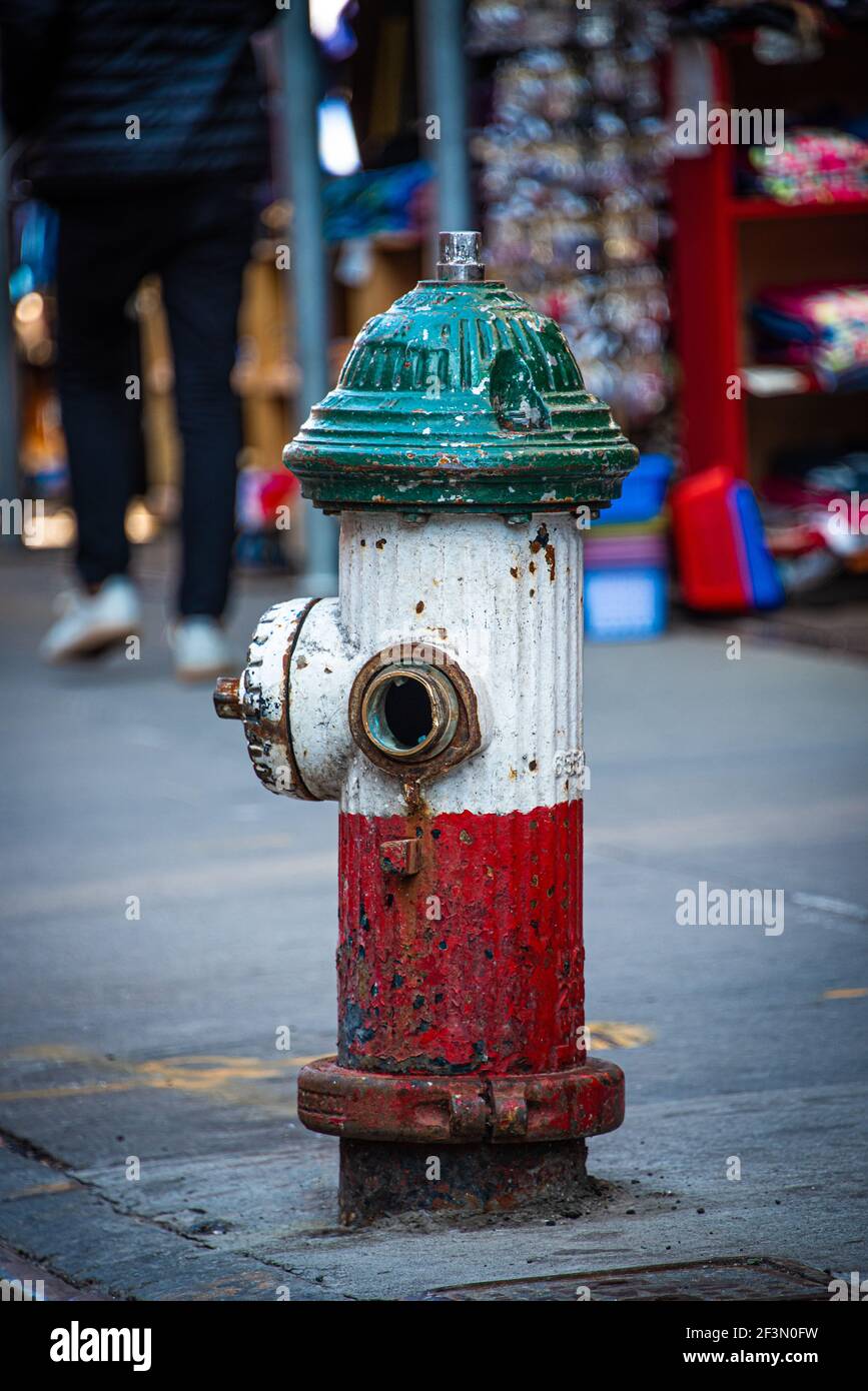 A colourful Fire Hydrant, painted in Italian flag colours, outside a ...