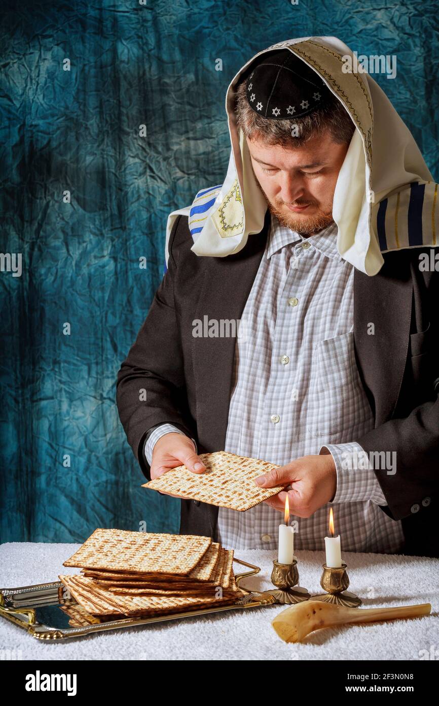 Jewish men is blessing on Matzah unleavened bread Stock Photo - Alamy