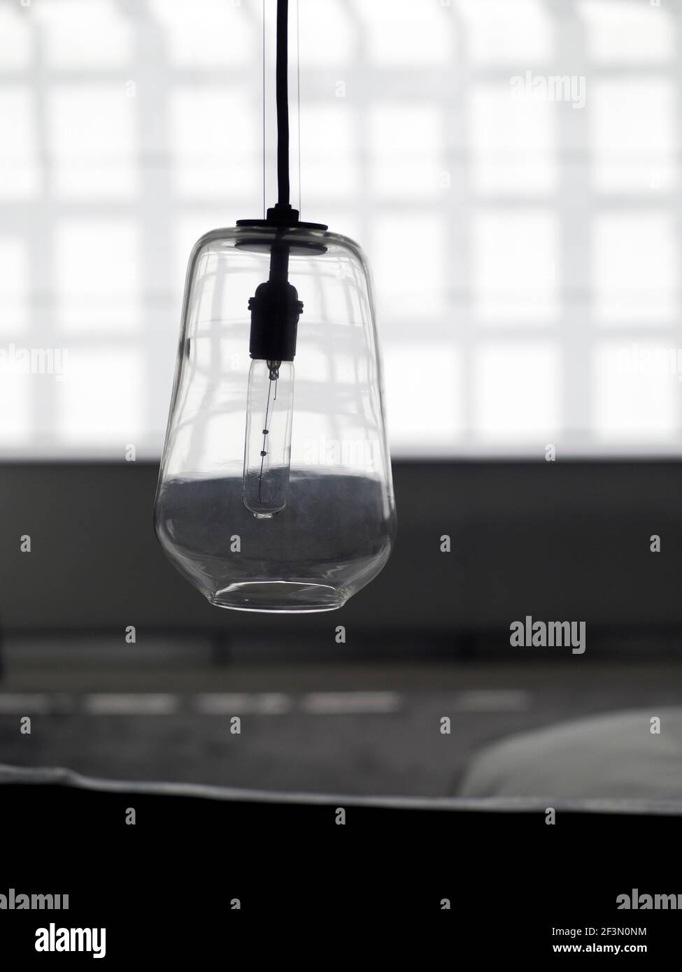 Simple pendant light fitting with glass shade in USA home Stock Photo ...
