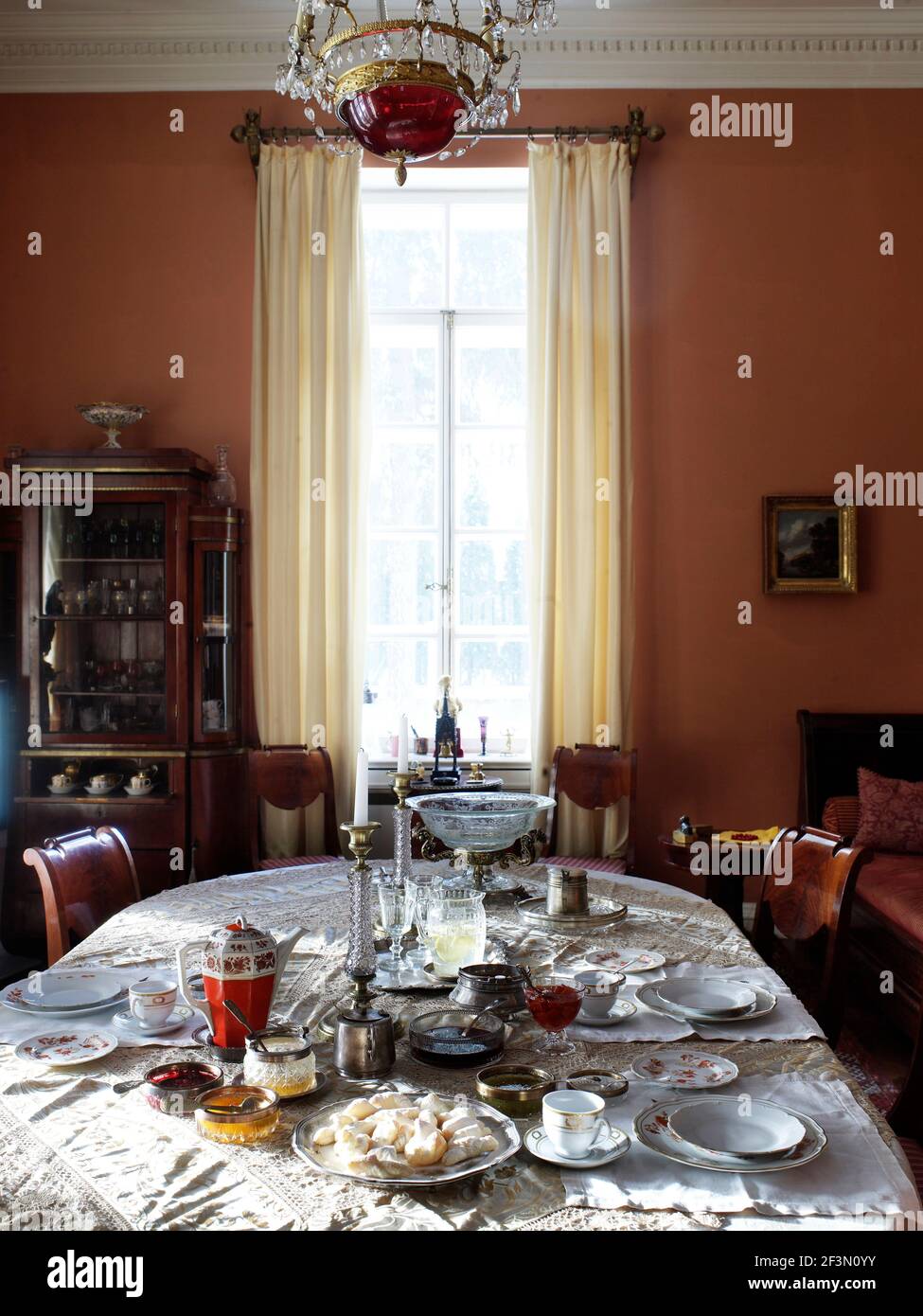Table laid for afternoon tea in dining room in Russian home Stock Photo ...