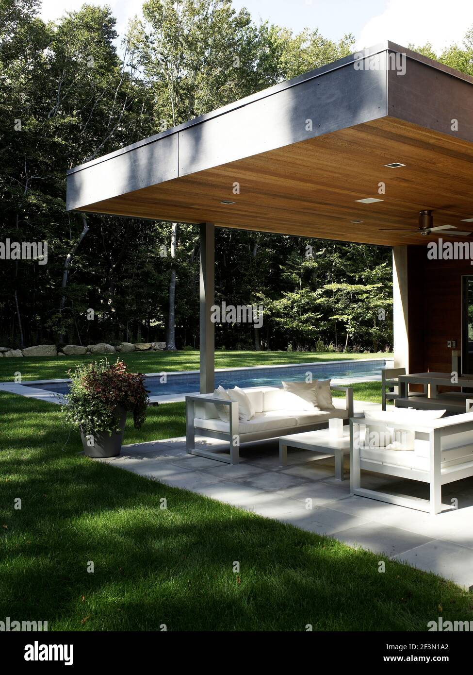 Seating on shaded terrace of USA home Stock Photo - Alamy