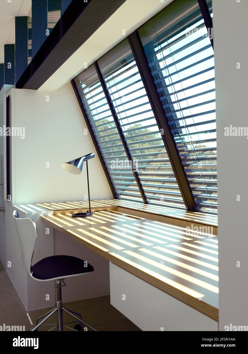 Home office area with desk below window in Australian home Stock Photo ...