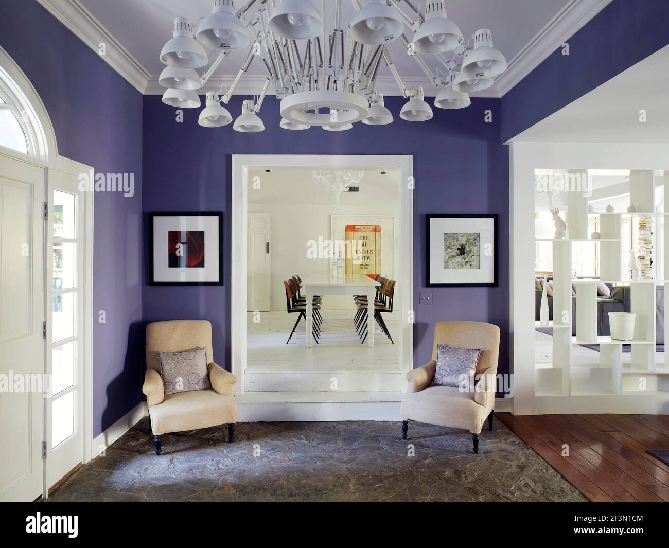 Two armchairs in spacious lavender blue hallway in USA home Stock Photo ...