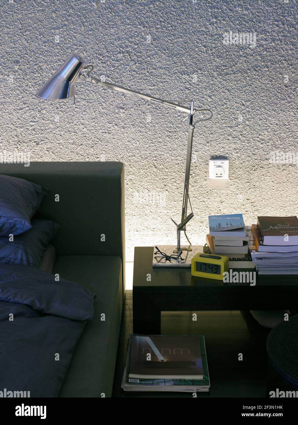 Anglepoise lamp on table next to bed in Singaporean home Stock Photo ...