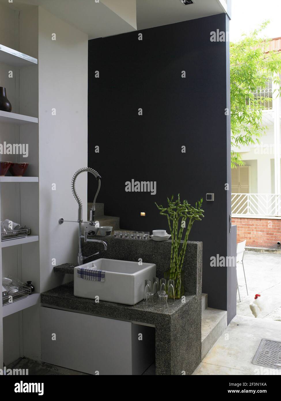 Spray tap over sink in kitchen in Singaporean home Stock Photo - Alamy