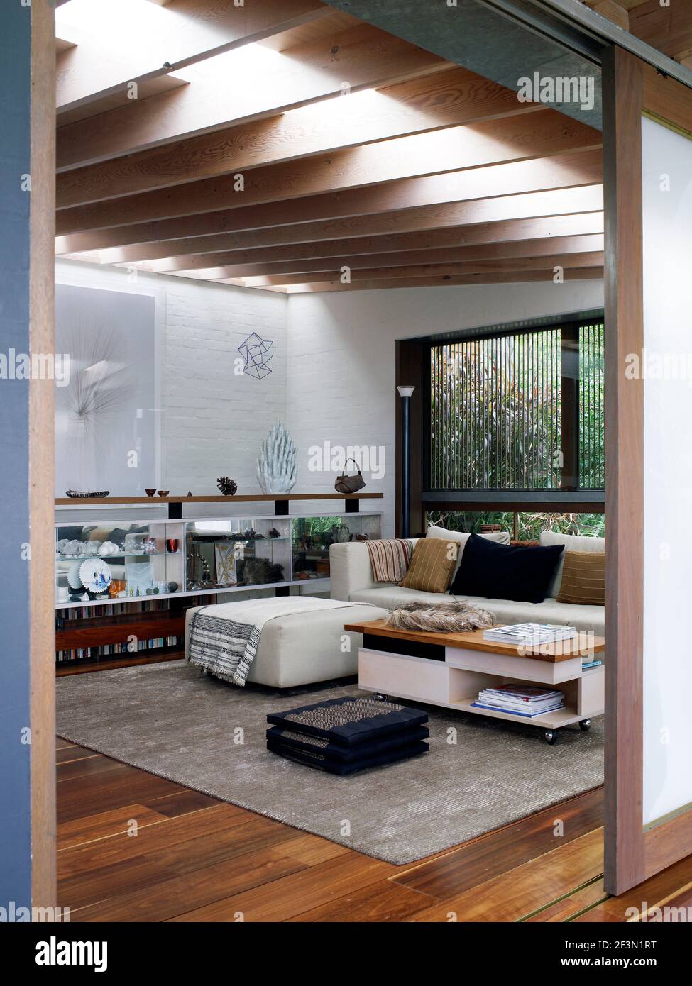 View through open door to living room in Australian home Stock Photo ...