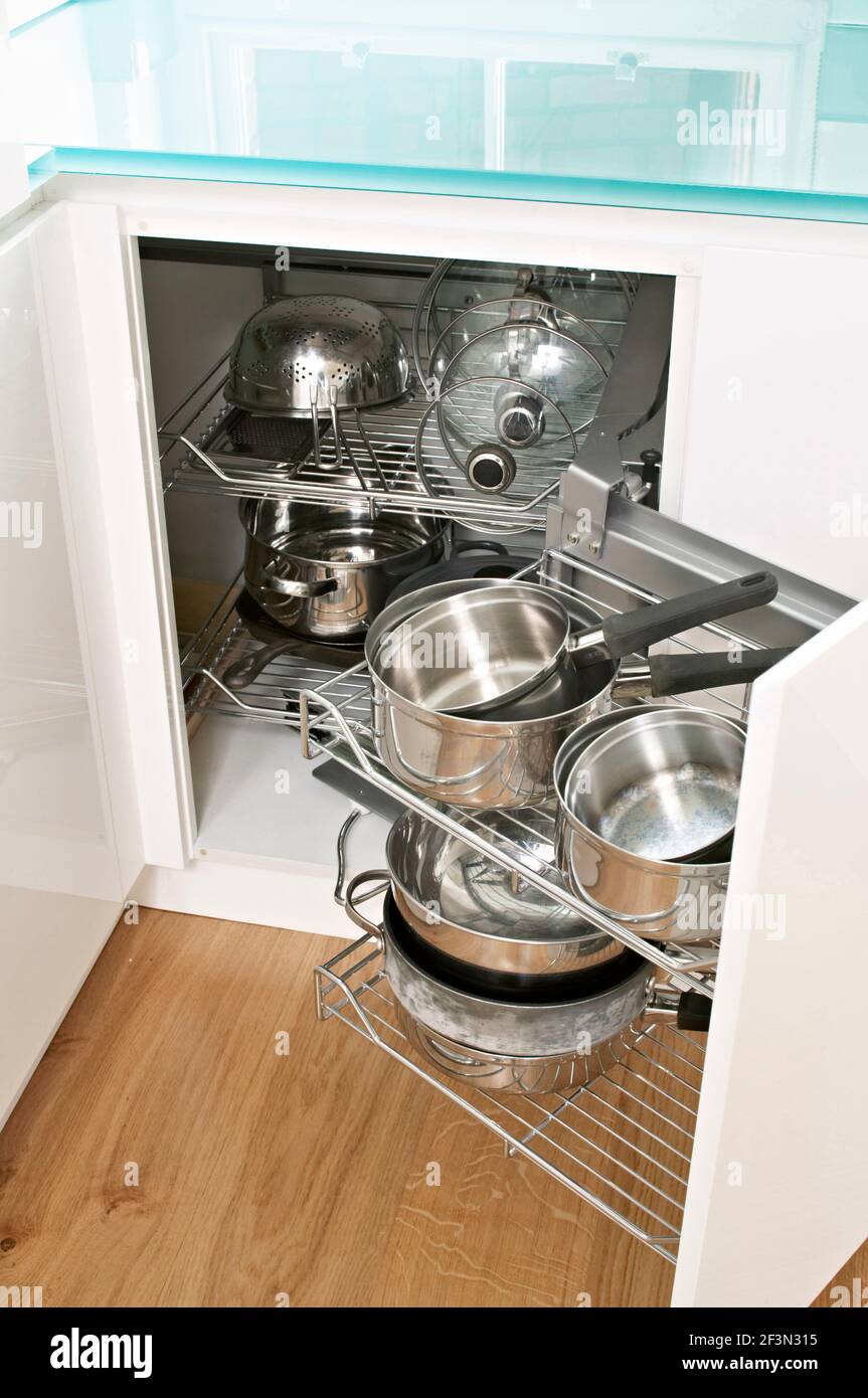 Open cupboard storage stainless steel cookware Stock Photo - Alamy