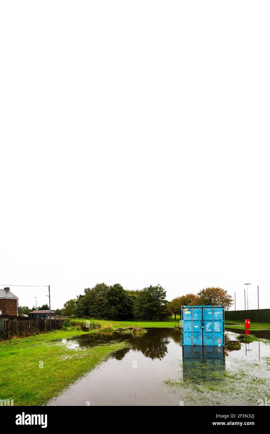 An old shipping container on flooded land Stock Photo - Alamy