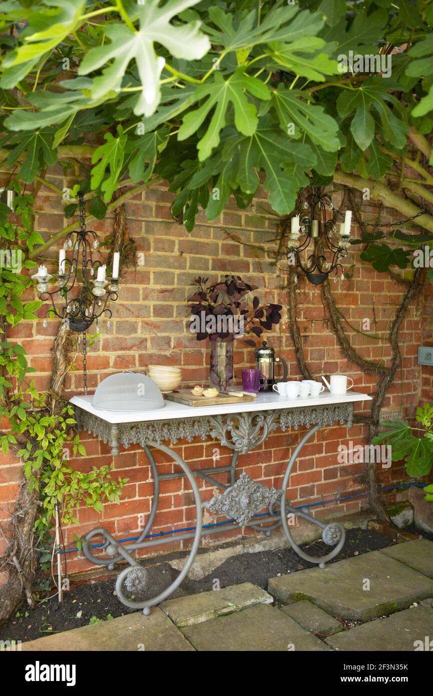 Wrought iron terrace table Stock Photo - Alamy