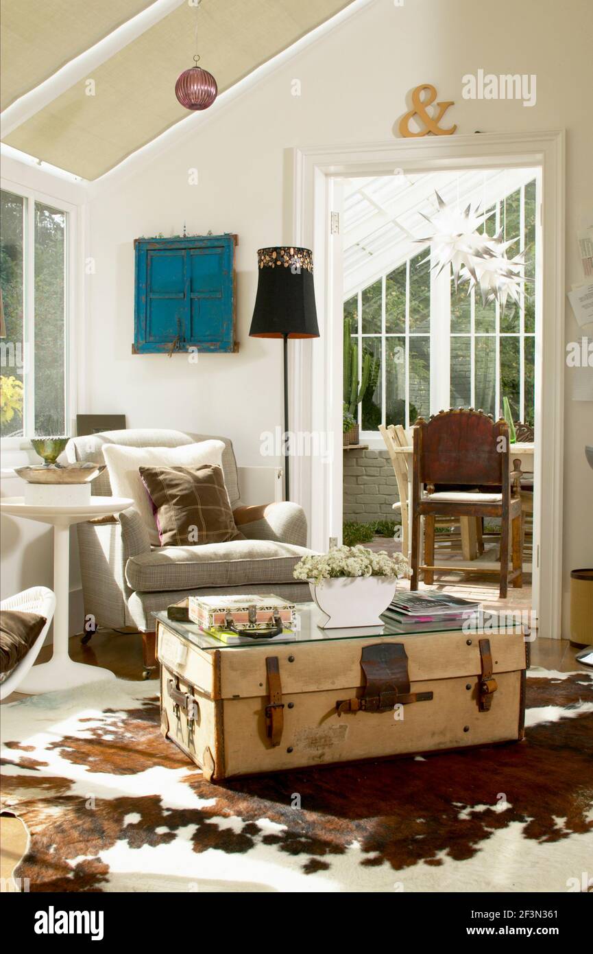 Detail of conservatory with packing trunk coffee table Stock Photo - Alamy