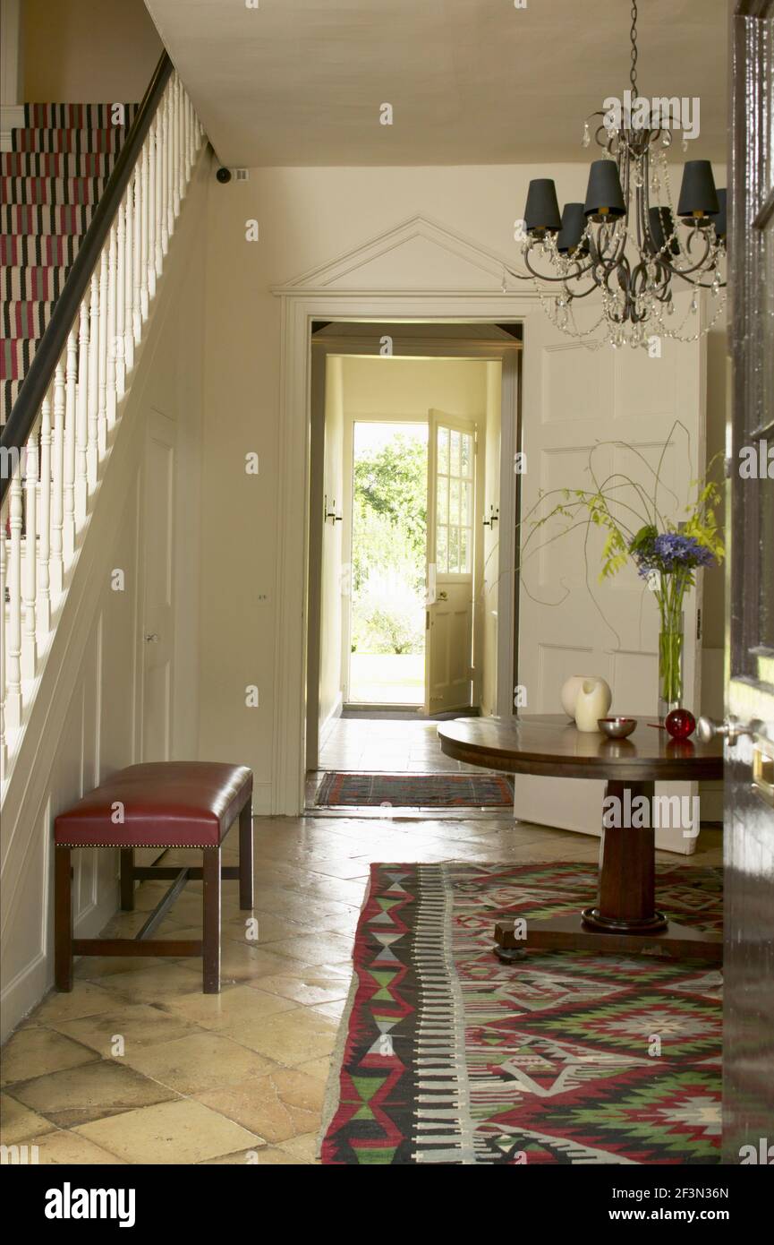 Entrance hall with view out of back door Stock Photo - Alamy