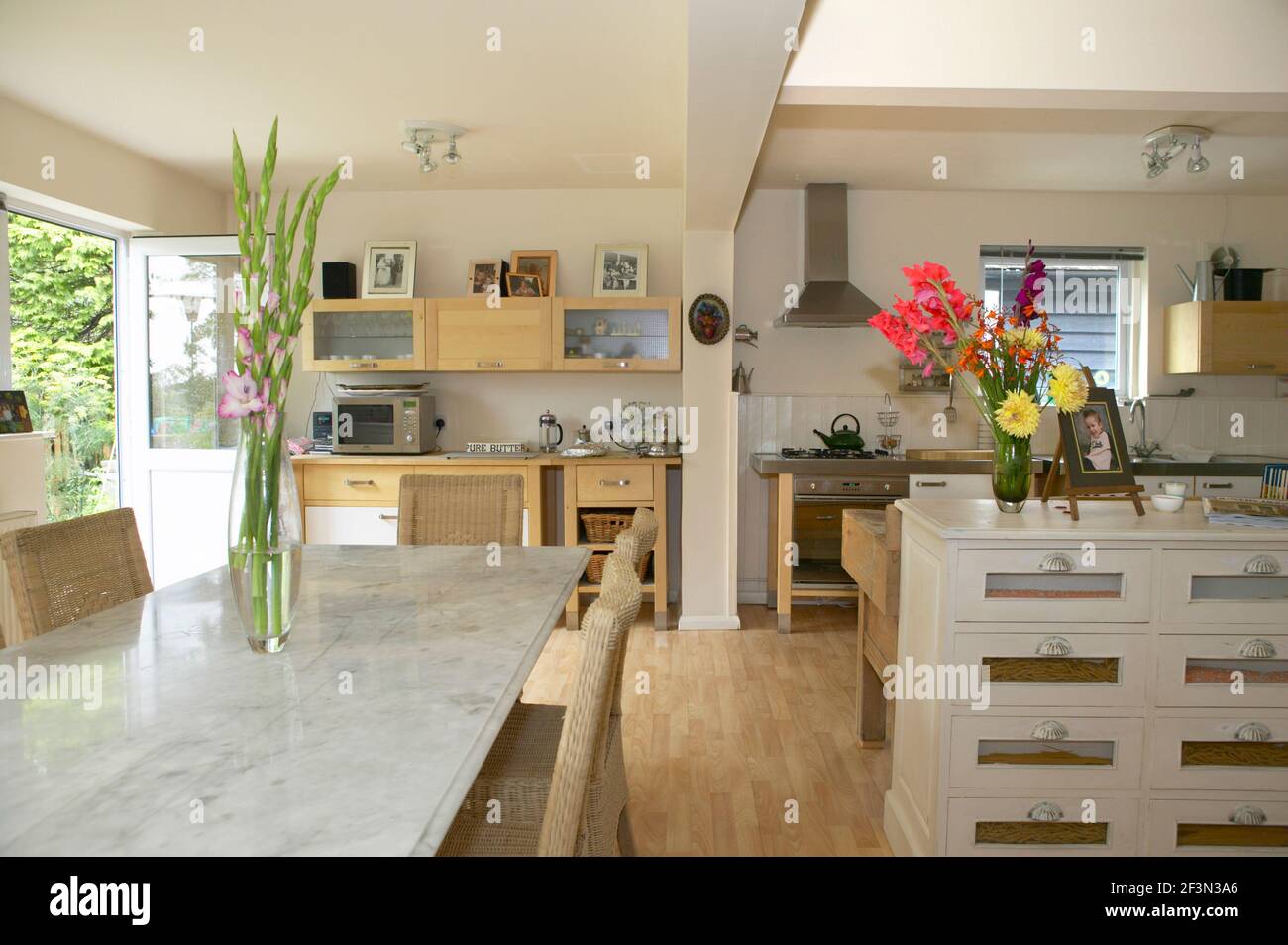 View of kitchen showing table and drawers Stock Photo - Alamy