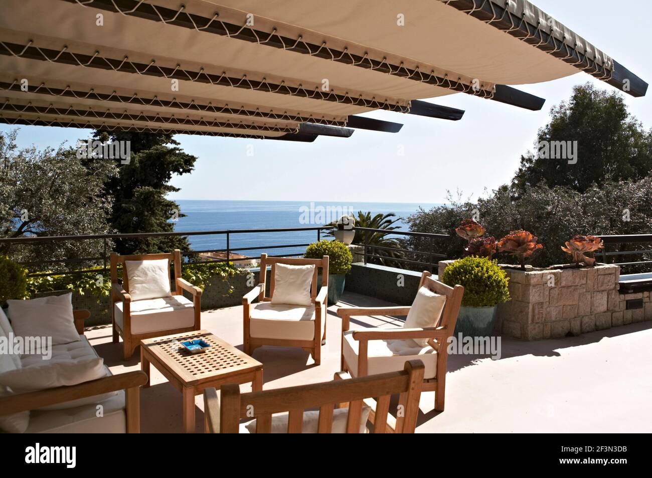 Seating on terrace overlooking ocean Stock Photo - Alamy