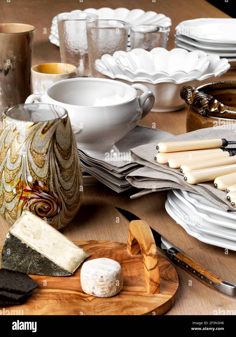 Cheese board and tableware, UK home Stock Photo - Alamy