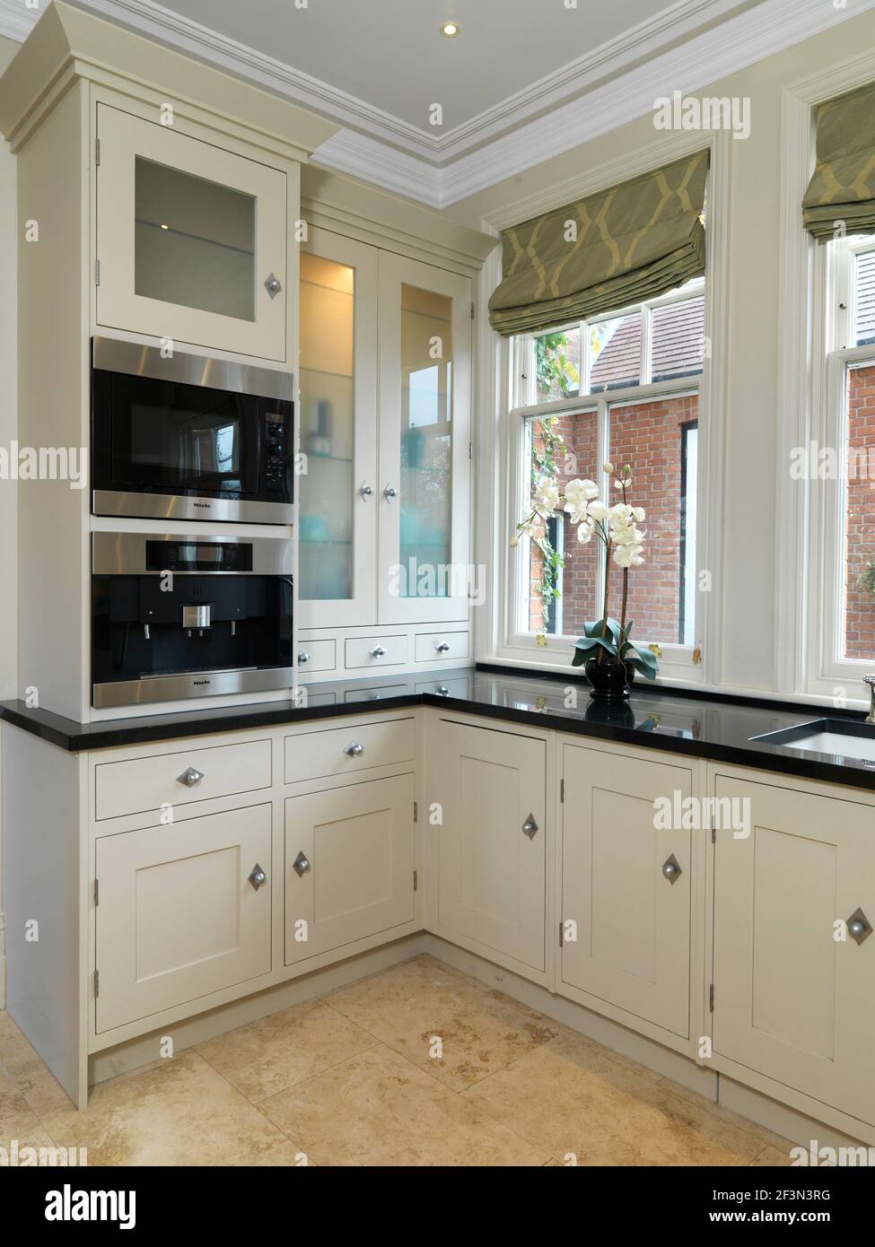 Corner of modern kitchen with neutral units, UK home Stock Photo - Alamy
