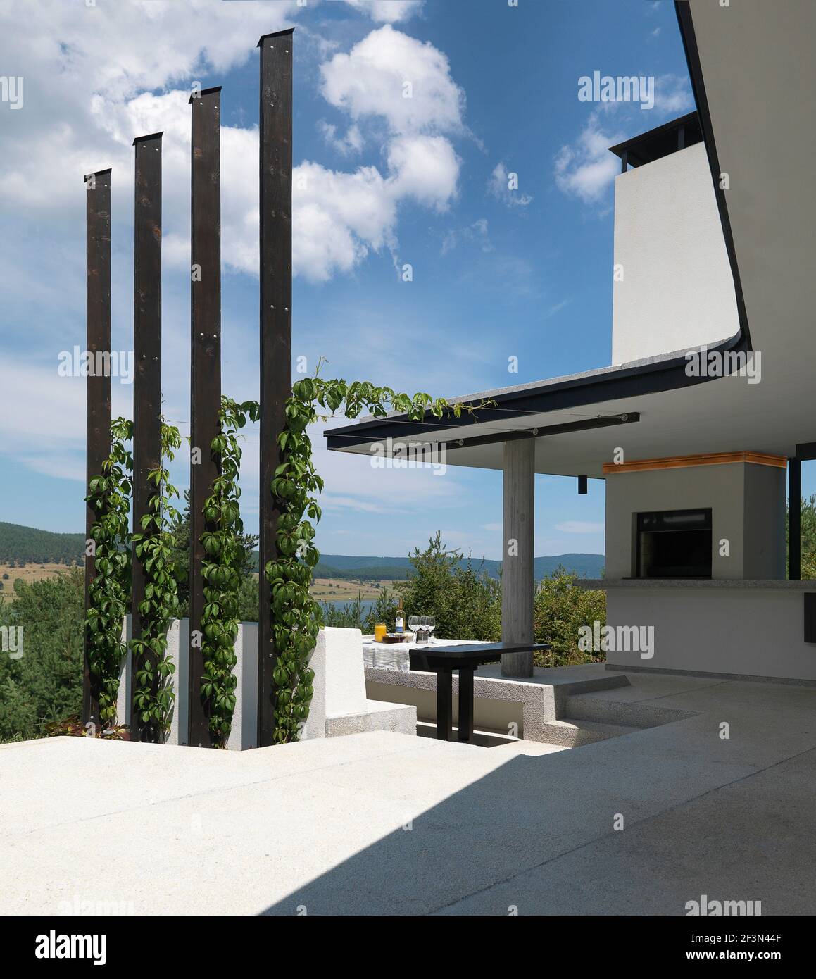 Terrace of modern house with view overlooking surrounding country, UK ...