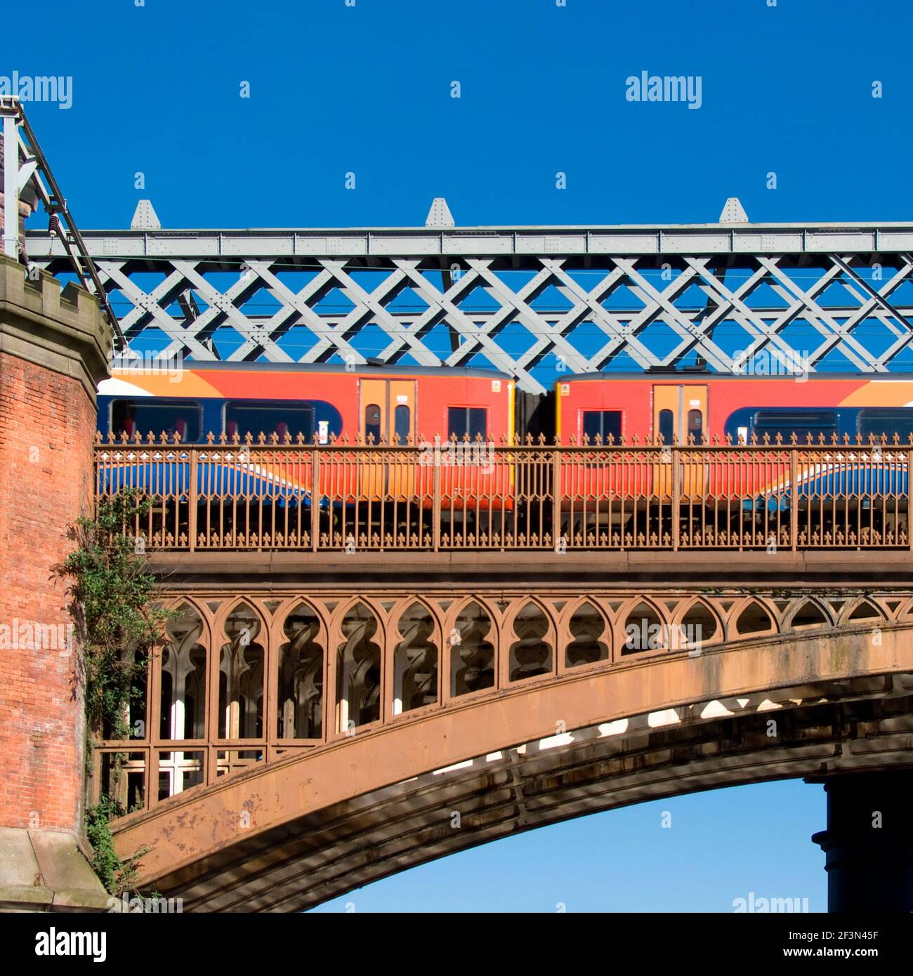 Train crossing the Southern Viaduct Bridge Castlefield Manchester ...