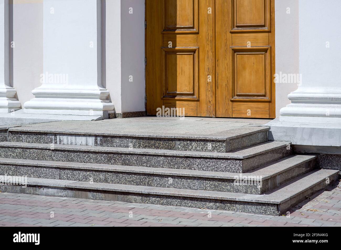 granite steps of a staircase with a threshold at the entrance to the ...