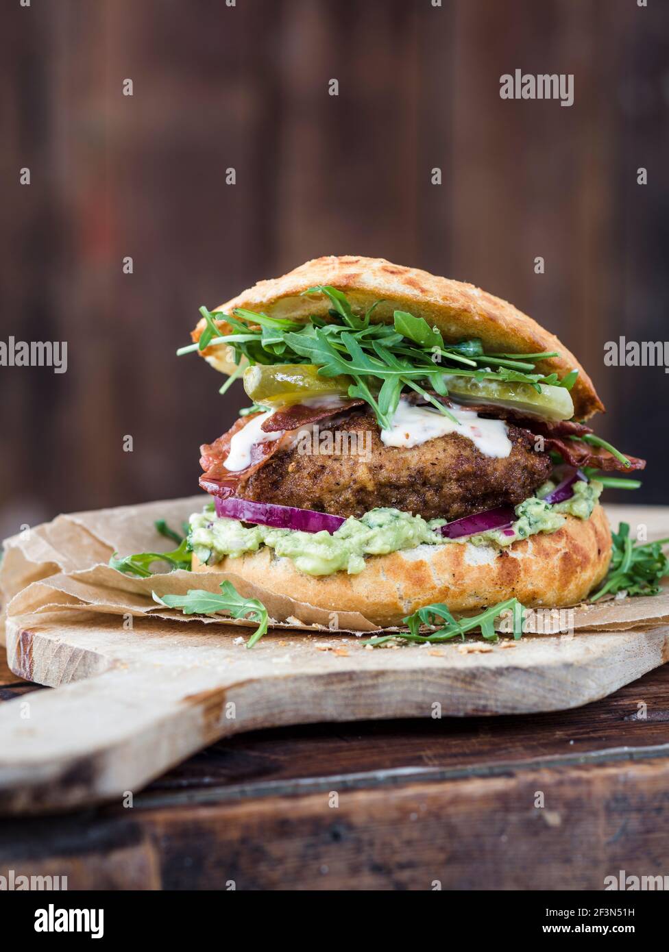 Chicken Burger with smashed avocado Stock Photo - Alamy