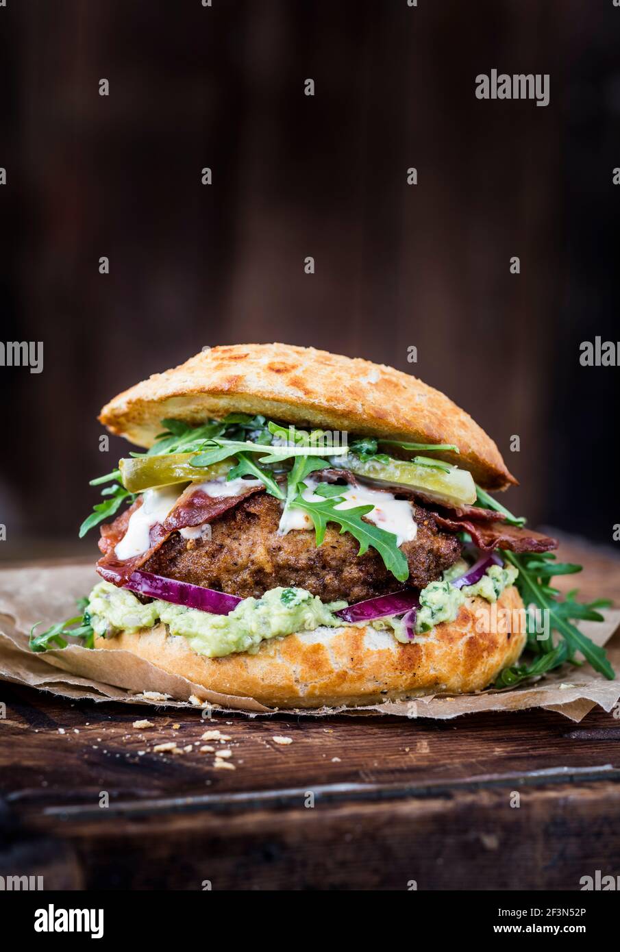 Chicken Burger with smashed avocado Stock Photo - Alamy