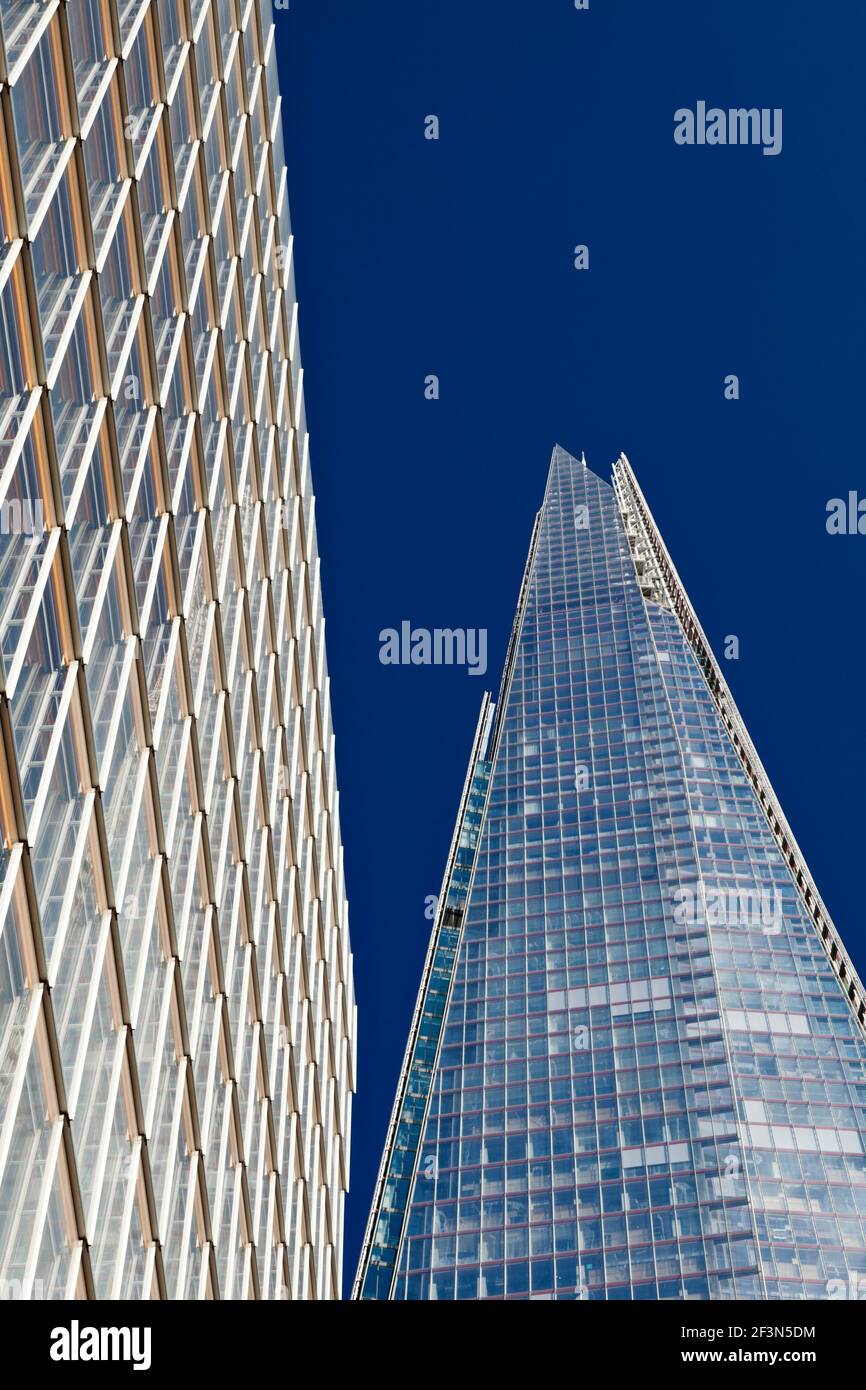 Gigantic glass facades of the Shard and facing office building in the ...