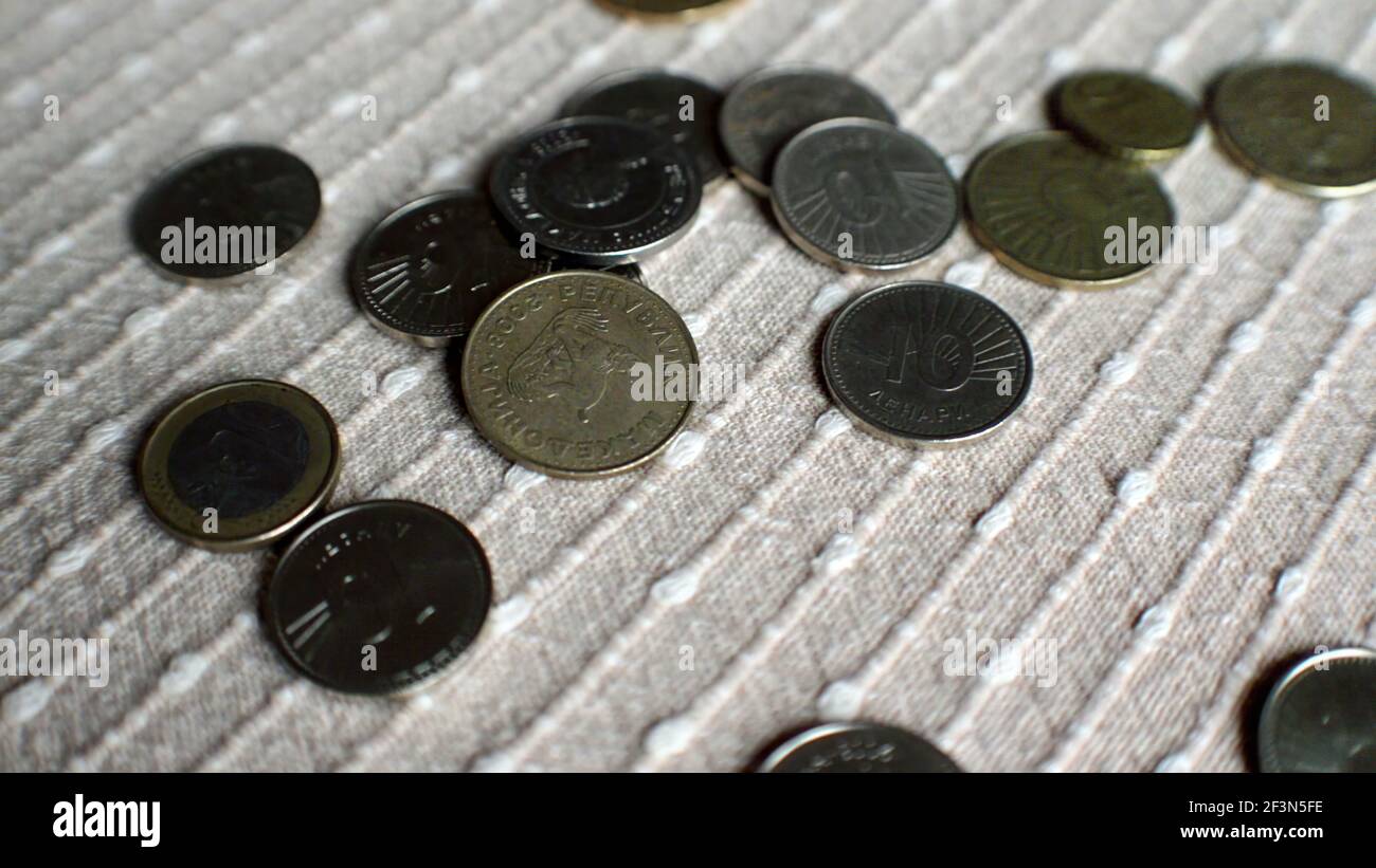 3D illustration - Coins fall onto a texture surface Stock Photo - Alamy