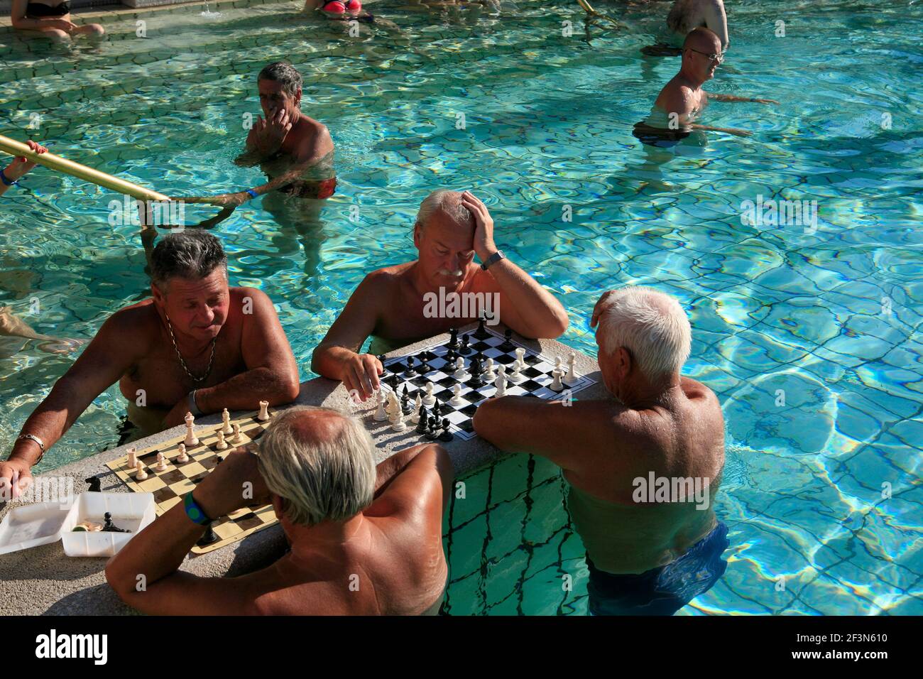 Men play chess in the pool in Szechenyi Spas, one of Europe's largest ...