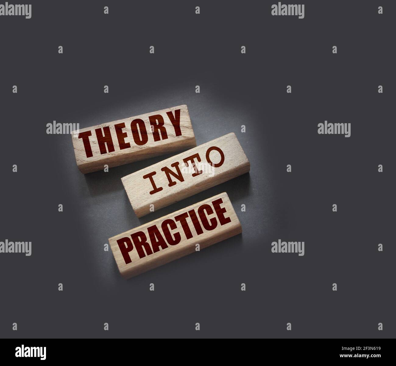 Theory into practice words written on wooden blocks. Education or ...